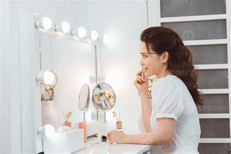 Amazing Young Woman Doing Her Makeup In Front Of Mirror Portrait Of