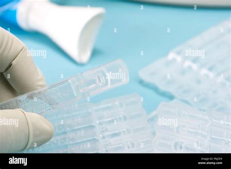 Nurse Holds Sterile Vial Of Ipratropium Bromide Ipratropium Is A Common Medication Name Stock