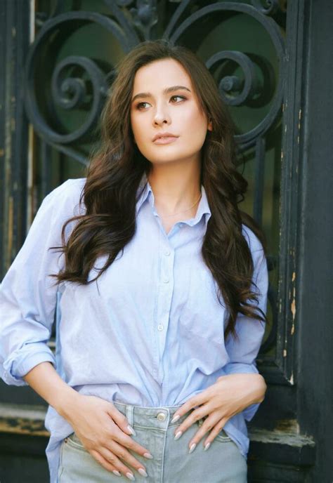 Fashion Portrait Of Beautiful Young Woman Wearing Blue Shirt Posing