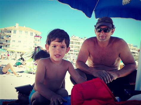 Premium Photo Portrait Of Shirtless Father And Son Enjoying At Beach