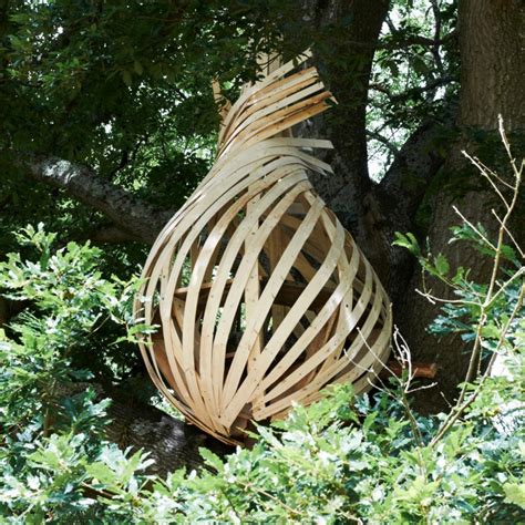 Nest Shaped Buildings Wrapped In Branches Twigs And Pine