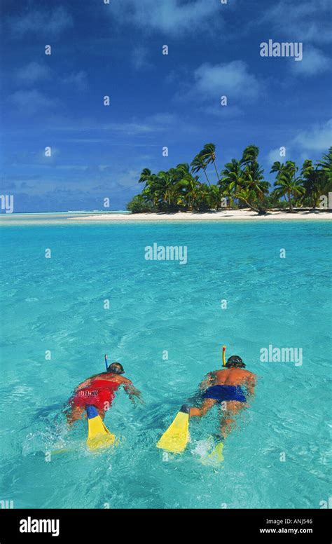 Couple Snorkeling Off One Foot Island In Aitutaki Island Lagoon Which