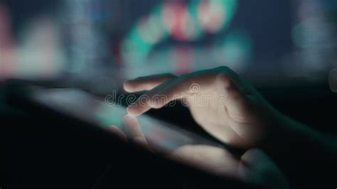 Person Analyzing Stocks Using Graphs And Charts On A Tablet App Stock