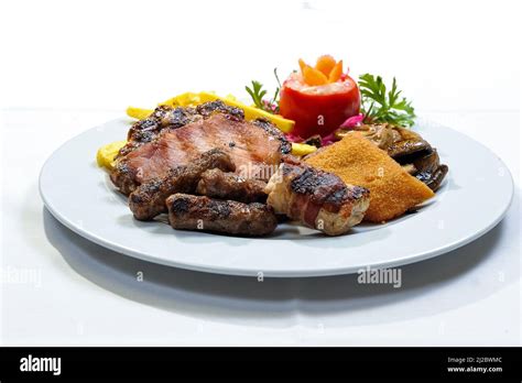 A Different Types Of Meat Dishes On A White Plate With White Background Stock Photo Alamy