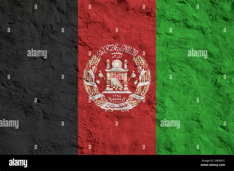 Afghanistan Flag Depicted In Bright Paint Colors On Old Relief