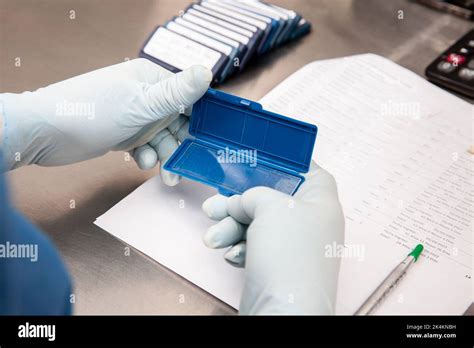 Laboratorian Giving Admission To Pap Smear Samples In The Laboratory