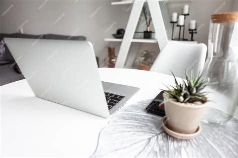 Premium Photo Empty Workspace With Laptop In Modern Interior