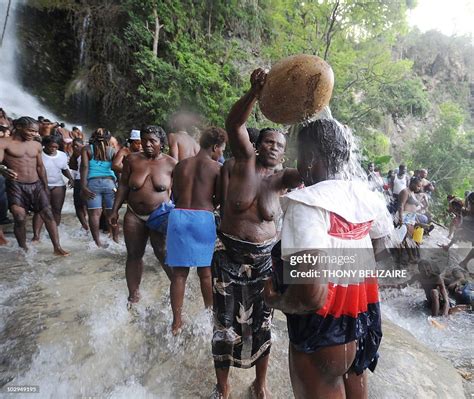 Haitians Bathe Under The Waterfall On July 16 2010 During The Annual