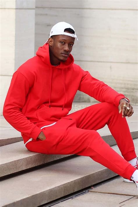Download Stylish Man In Bold Red Hoodie Wallpaper