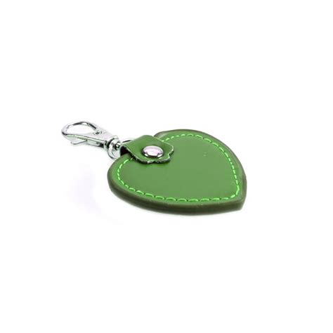 Premium Photo Close Up Of Heart Shape Key Ring On White Background