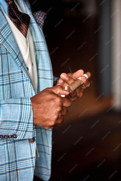 Premium Photo Closeup Of Male Wearing Blue Suit And Holding Cigar