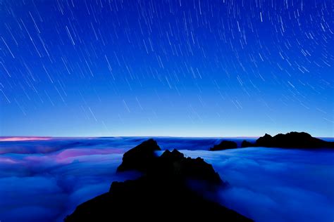 The Night Sky Is Full Of Stars Above The Clouds Photo Free Nature