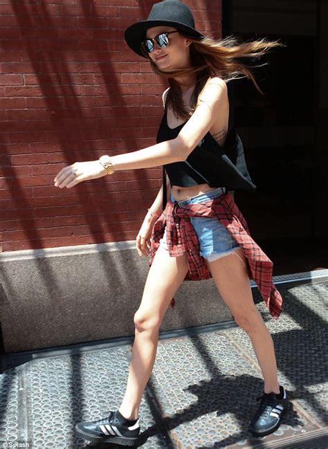 Behati Prinsloo Bares Her Midriff In Grunge Ensemble As Fiance Adam