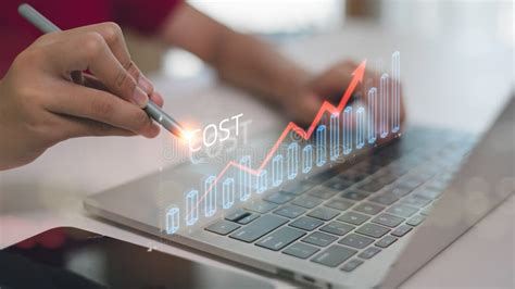 Cost Reduction Concept Businesswoman Pointing Down Arrow Of The Graph