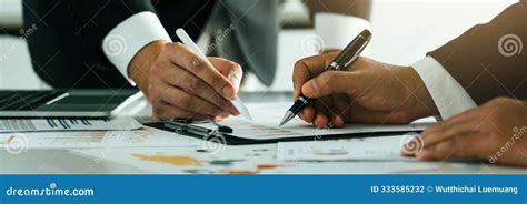 Two Businessman Team Calculate About Summary Report Annual On Table