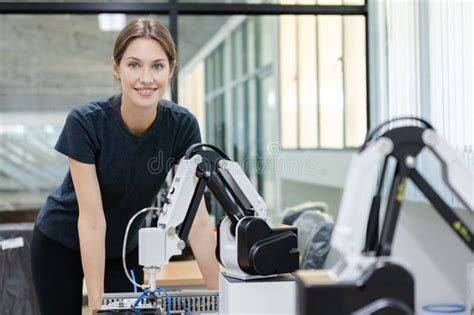Female Staff Engineer With Robot For Education On Table At Class Room Education Classroom For
