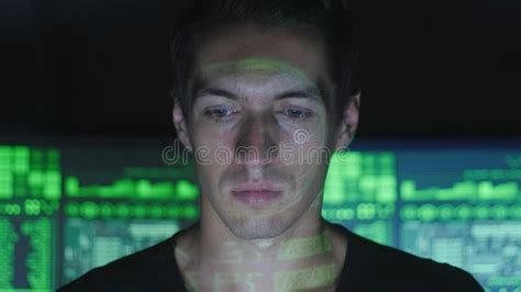 Hacker Programmer In Glasses Is Working On Computer In Cyber Security Center Filled With Display