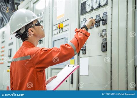 electrical and instrument technician checking electricity system stock