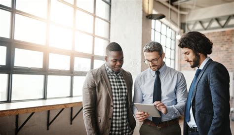 Three Heads Are Always Better Than One Three Well Dressed Businessmen Brainstorming Together