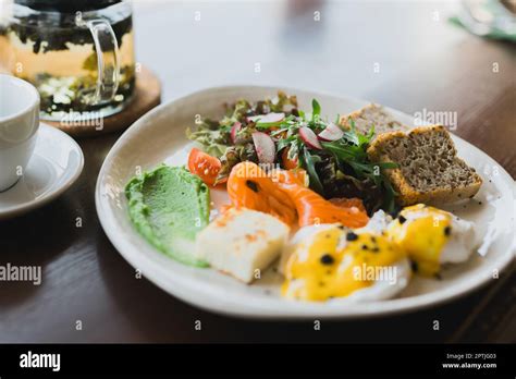 Light And Hearty Breakfast Brunch With Scrambled Eggs Toast On Grain