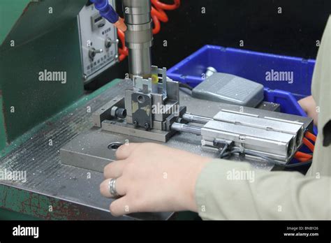 Semi Automated Fixture Used To Rivet Movement Assembly Of Speedometer