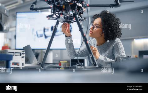 Concentrated Black Female Engineer Writing Code Developing Software