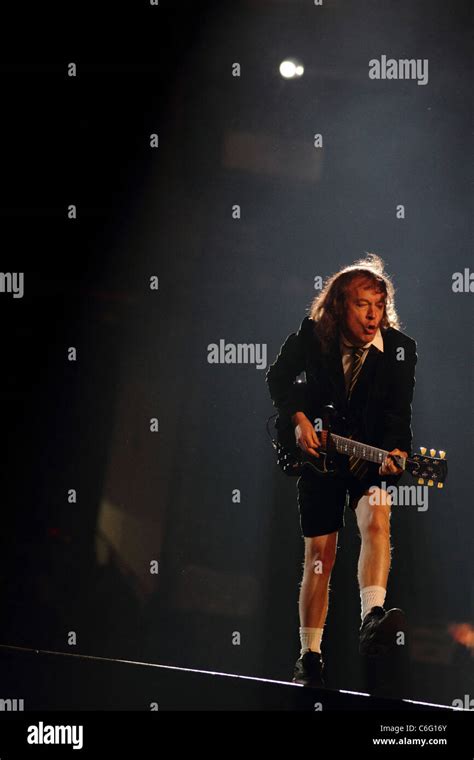 Angus Young Of Acdc Performing Live In Concert As Part Of The Black