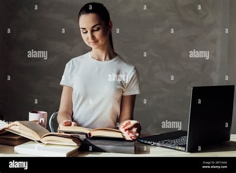 Girl Reading A Book And Is Preparing For The Exam Stock Photo Alamy