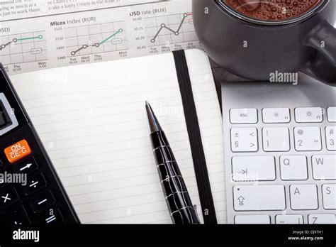 Business Photo Tea With Open Note Pen Calculator Newspaper Stock Index Overview And