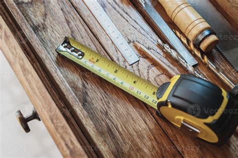 Tape Measure With Linear Measured Markings On Wooden Background Diy