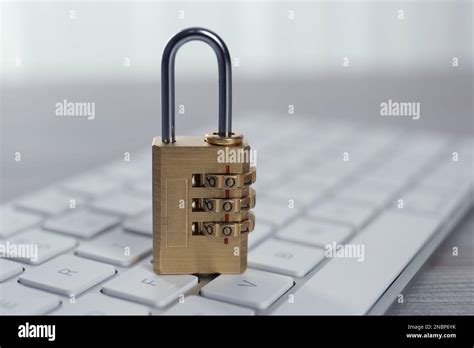 Metal Code Padlock And Computer Keyboard On Table Closeup Cyber Security Concept Stock Photo