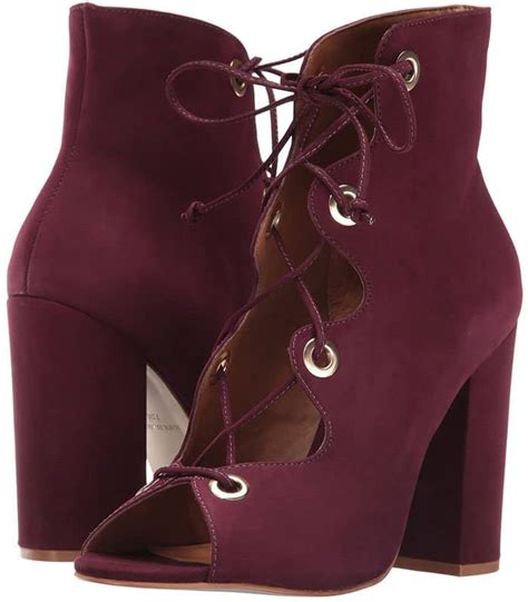 Kim Kardashian Ditches Bra In Burgundy Yeezy Lace Up Boots