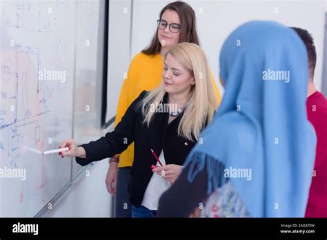 Female Architecture Teacher At Work Female Professor Explain Architectural Projects To Babes