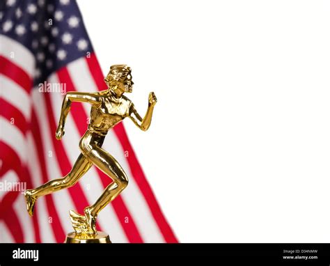 Golden Runner Trophy With Blurred American Flag On The Background Stock