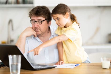Father Helps Daughter Do Homework Using Laptop Stock Image Image Of