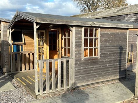 10ft X 8ft Log Lap Cabin With 4ft Veranda Ex Display Skinners Sheds