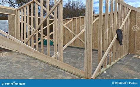 Construction Work In Progress An Unfinished House With Wooden Framing