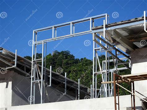 Installation Of The Aluminum Cladding Frame At The End Of The Roof Is Underway Stock Image