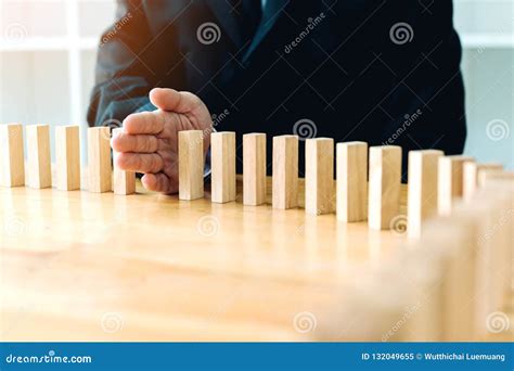 Close Up Hand Businessman Stopping Wooden Block From Falling In Stock Image Image Of Economy