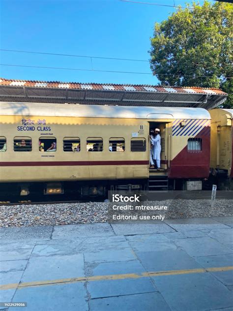 Image Of Second Class Train Carriage Passenger Hanging Out Open Door Of