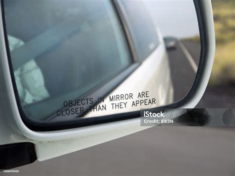 Objects In Mirror Are Closer Than They Appear Inscription On The Car