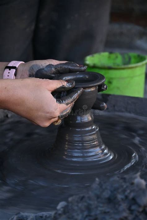 Closeup Of Two Hands Modeling Clay During A Pottery Workshop In Pottery Square In Bhaktapur