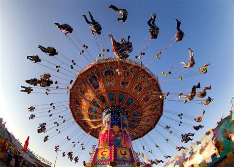 Thrilling Carnival Swing Ride Vibrant Amusement Park Hd Wallpaper