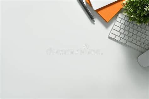 White Office Desk With Keyboard Mouse Notebook And Houseplant Top View With Copy Space For