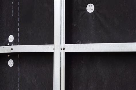 Close Up View Of Facade Insulation System Installation Featuring Profiles For Cladding