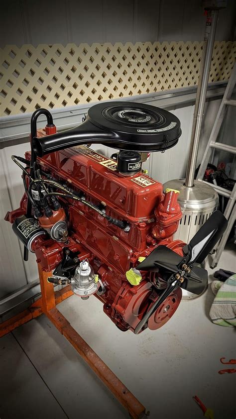 Red Engine On Wooden Stand