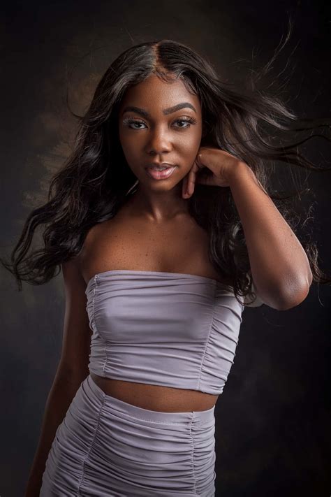 Download Confidence In Her Beauty A Stunning Black Woman In Purple