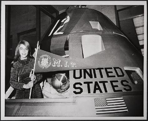 Margaret Hamilton Poses Next To A Huge Stack Of Code She Wrote By Hand