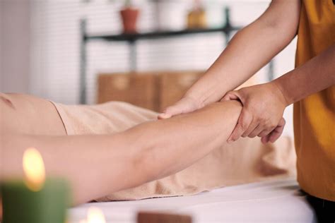 Premium Photo Cropped Image Of Physiotherapist Giving Arm Massage To