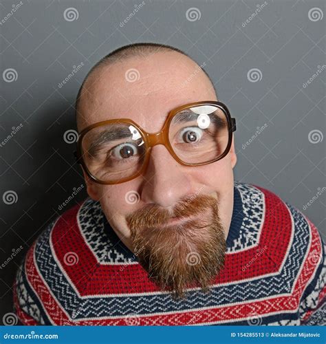 Portrait Of A Nerd With Glasses And Retro Sweater Against Gray Background Stock Image Image Of